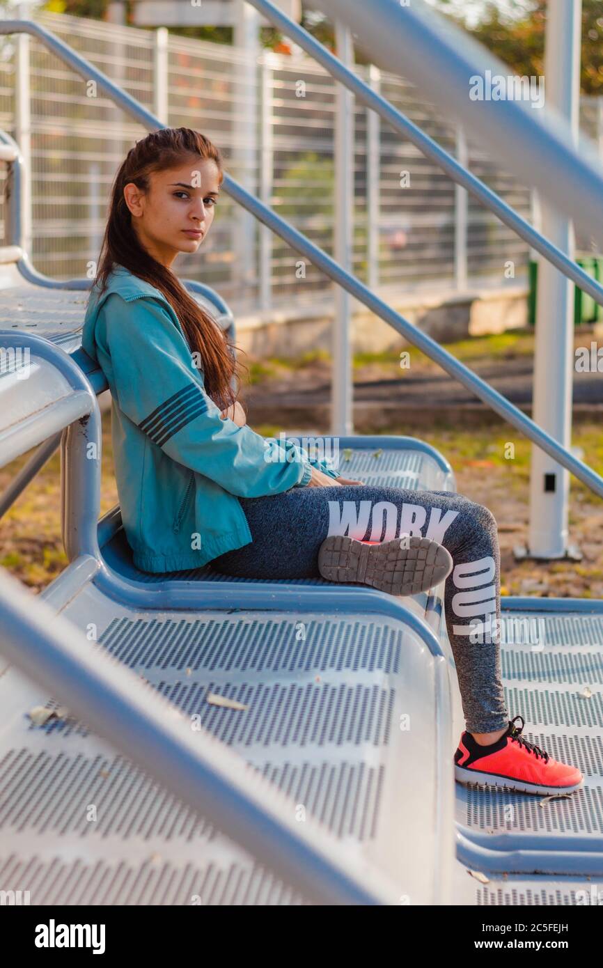 Mexican fitness girl watching a ball match Stock Photo - Alamy