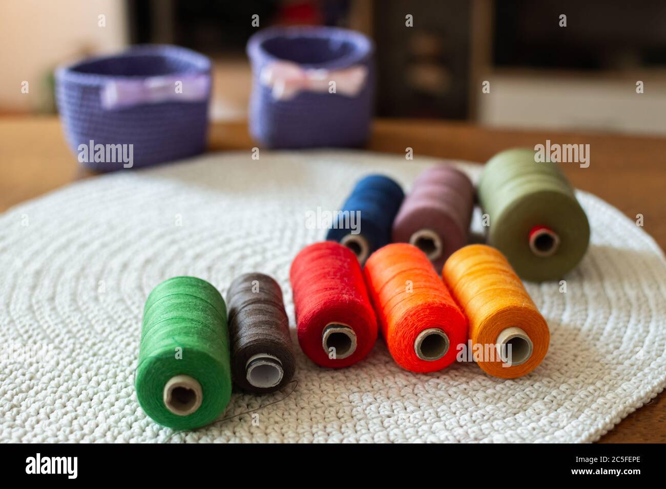 Colorful threads on table Stock Photo - Alamy
