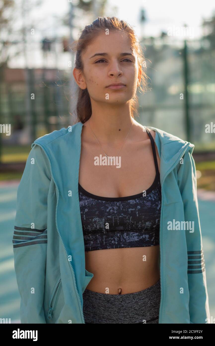 Mexican fitness girl watching a ball match Stock Photo - Alamy