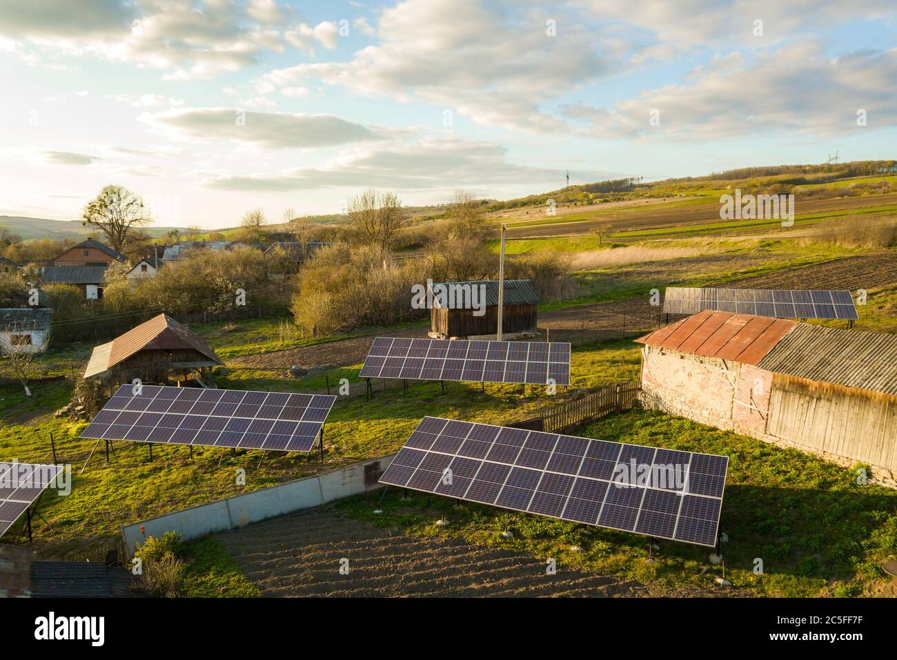 Aerial top down view of solar panels in green rural village yard Stock ...
