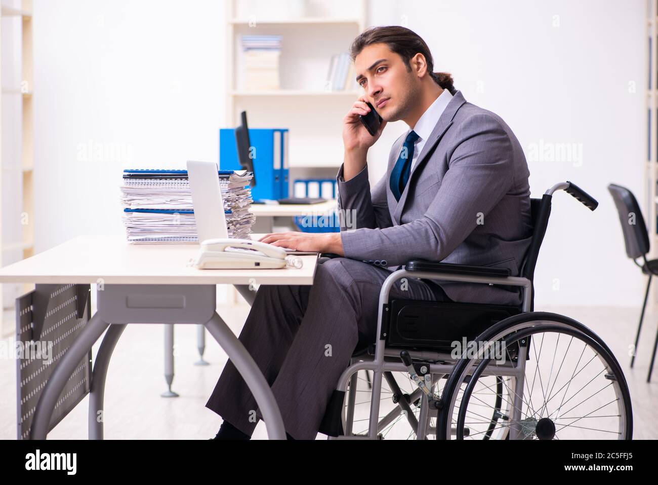 Disabled employee in the office environment Stock Photo - Alamy