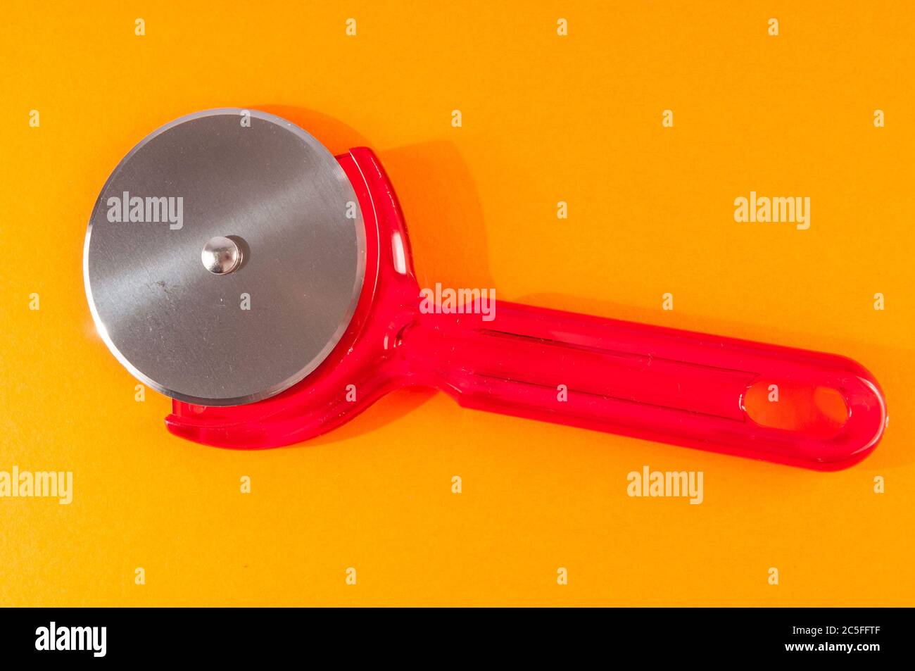 Picture of Plastic Red Pizza Cutter Slicer Knife Stock Photo - Alamy