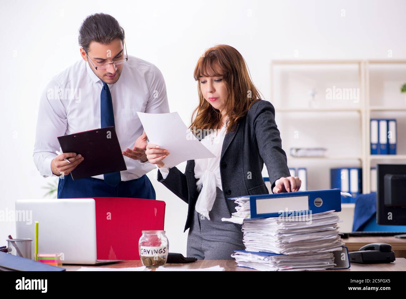Two employees working in the office environment Stock Photo - Alamy