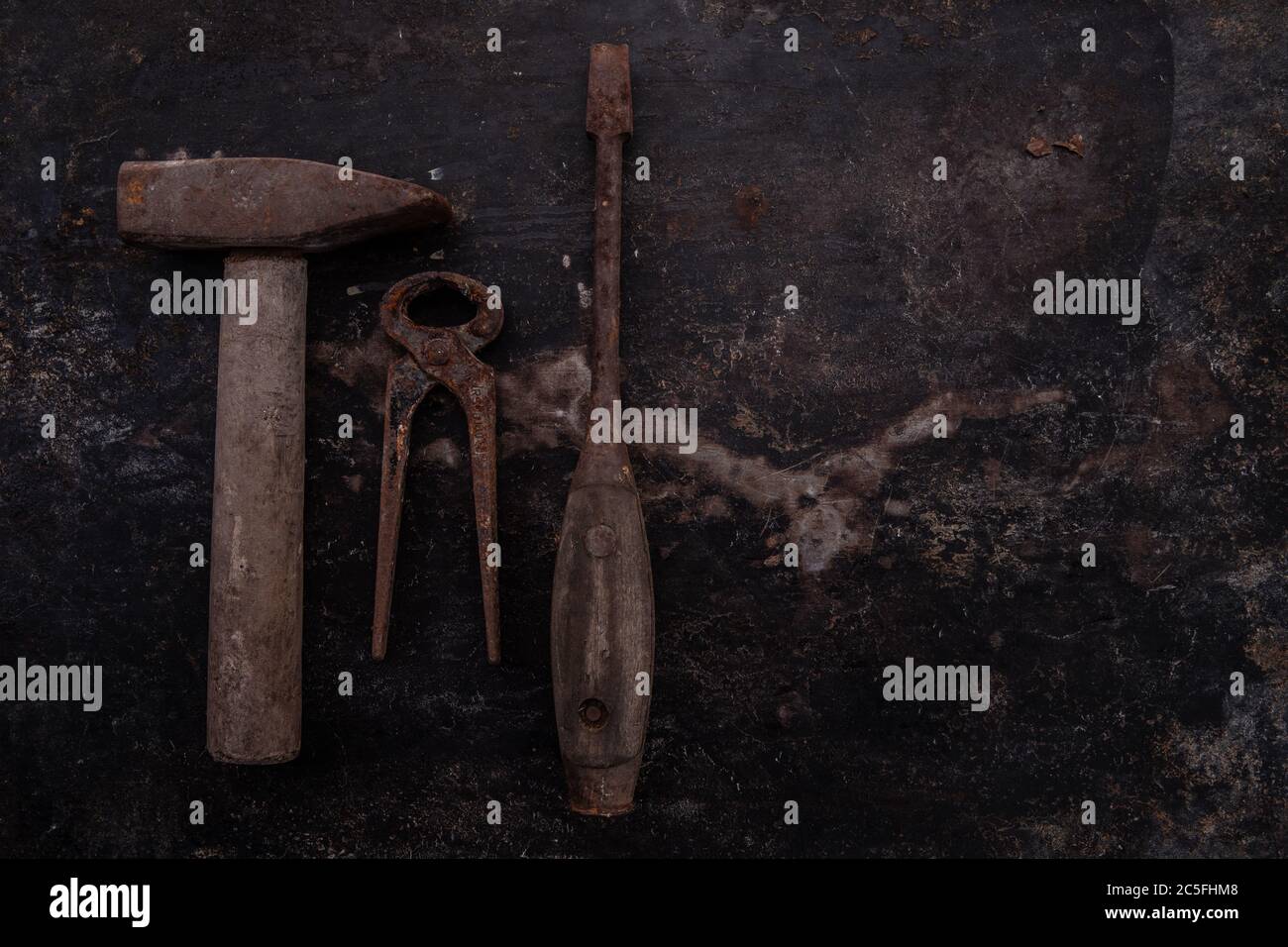 old tools, hammer, chisel, spatula measuring tape and brushes greasy ...