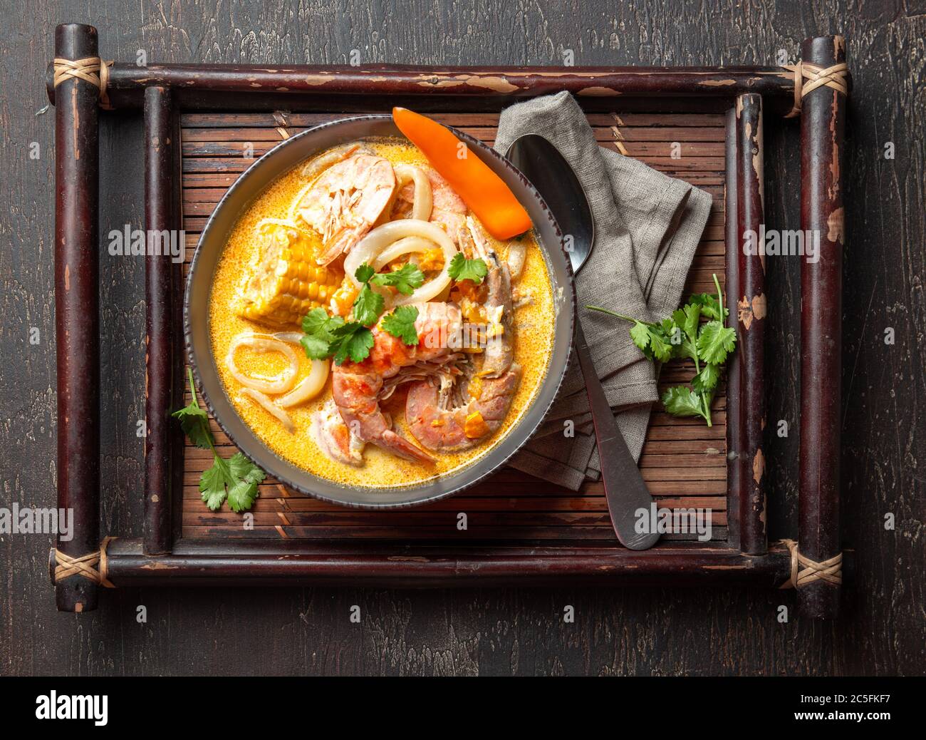 Peruvian seafood soup Chupe de Camarones in gray bowl, top view Stock ...