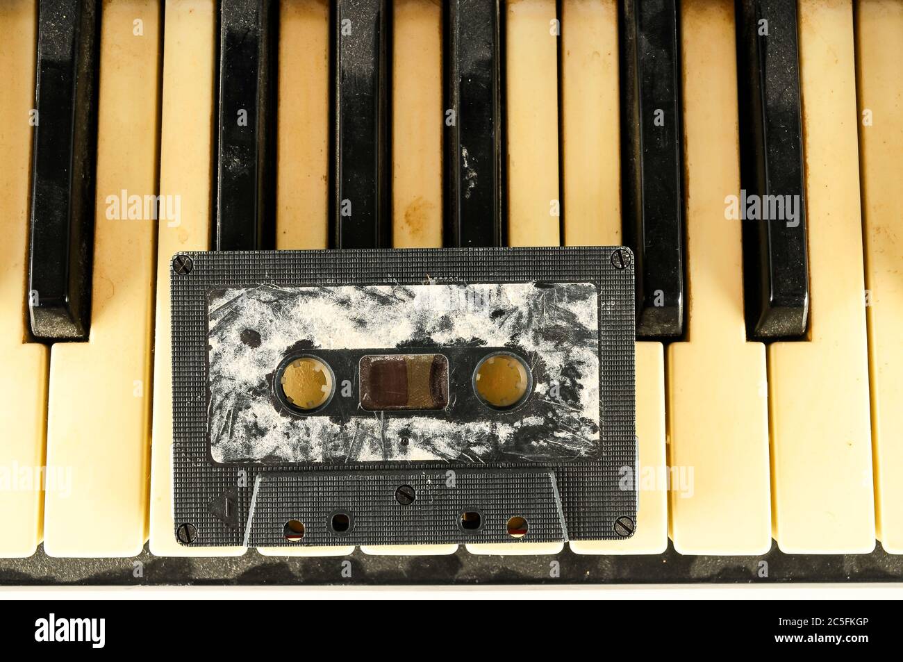 Photo picture close-up of piano keys keyboard and musicassette tape ...