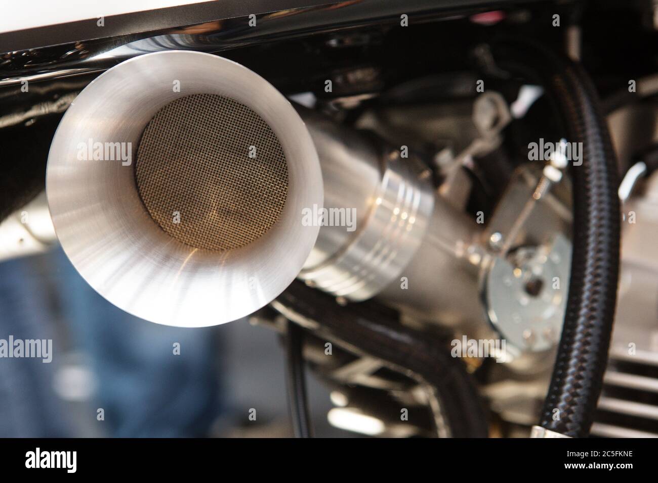 close up detail of a carburetor and air intake on a motorbike engine ...