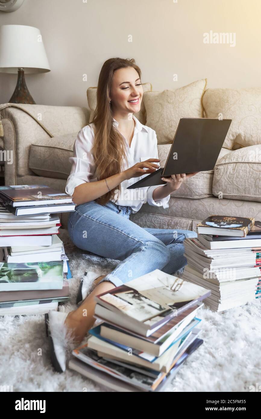 Young student watching lesson online and studying from home. Girl ...