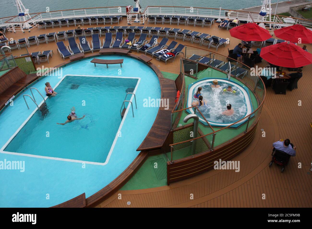 Cruise ship's pool for vacationers on their cruise, having fun at sea ...