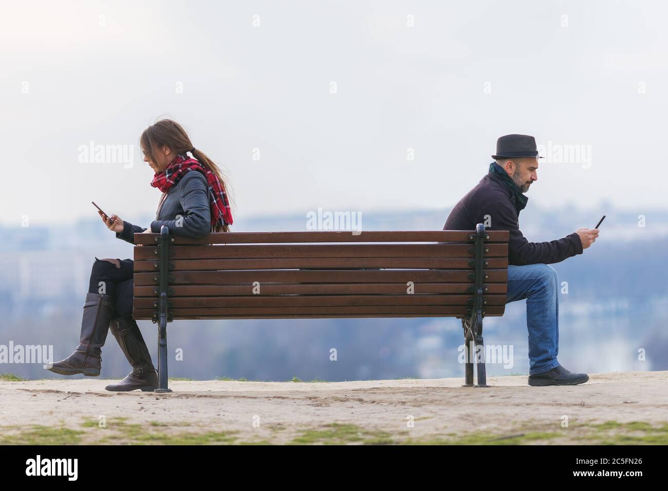 2 People Sitting On A Bench