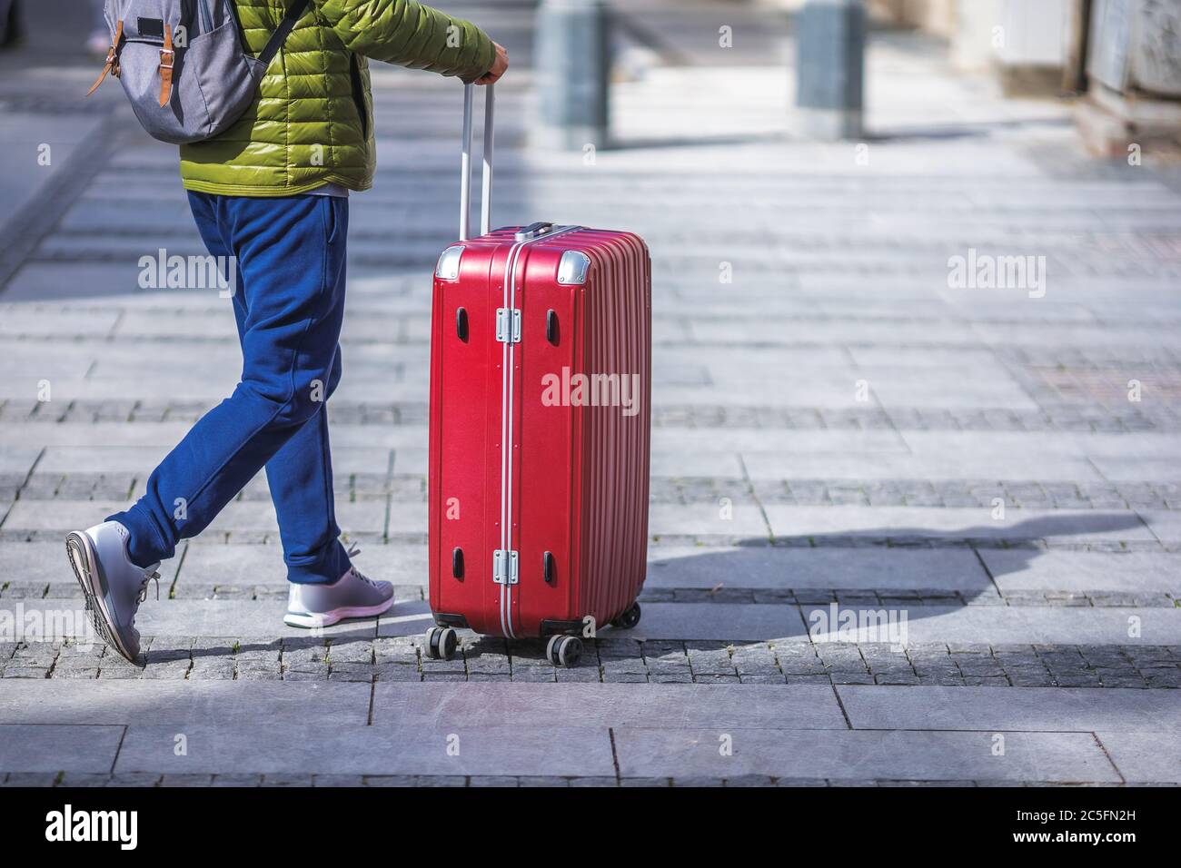 Walking with bag on wheels hi-res stock photography and images - Alamy