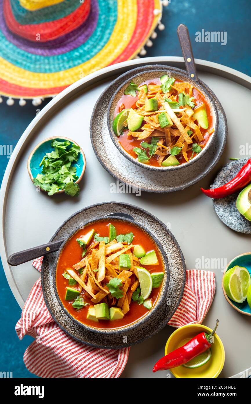Mexican style table with spicy aztec soup with fried tortilla. Sopa ...