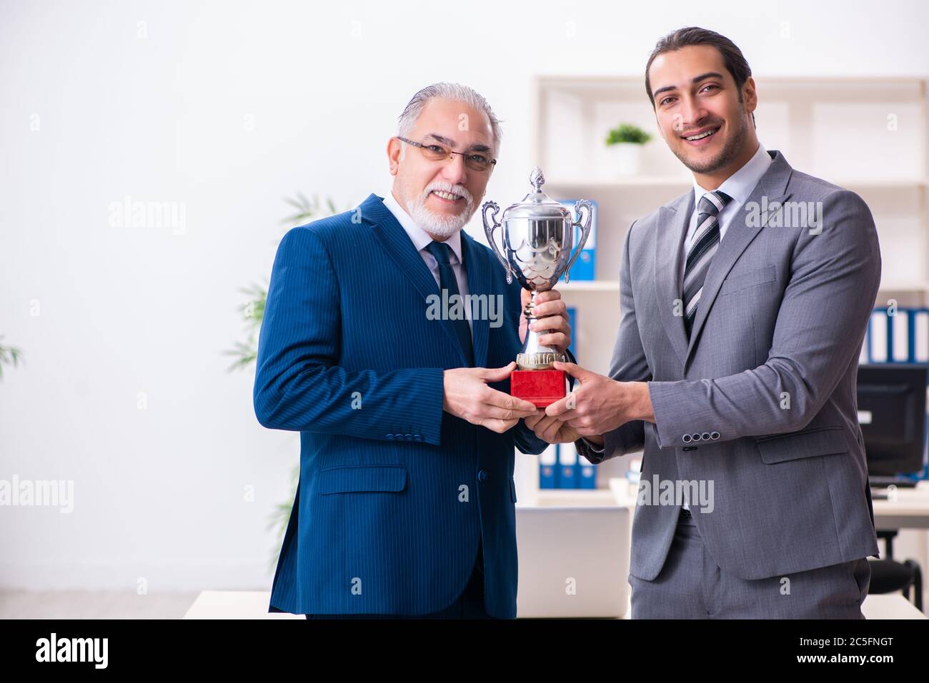 Two employees working in the office Stock Photo - Alamy