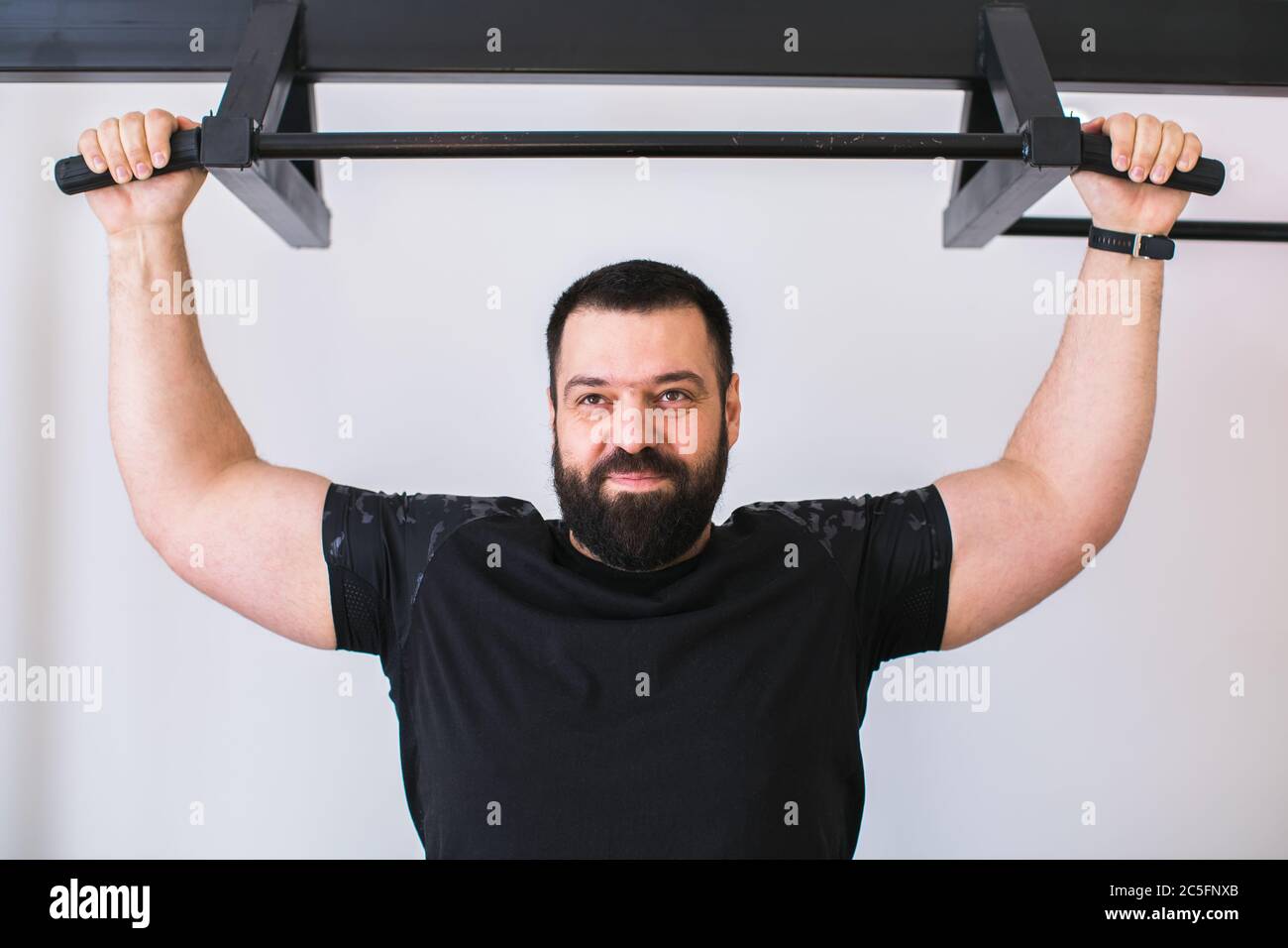 man training at the gym isolated on white background Stock Photo - Alamy