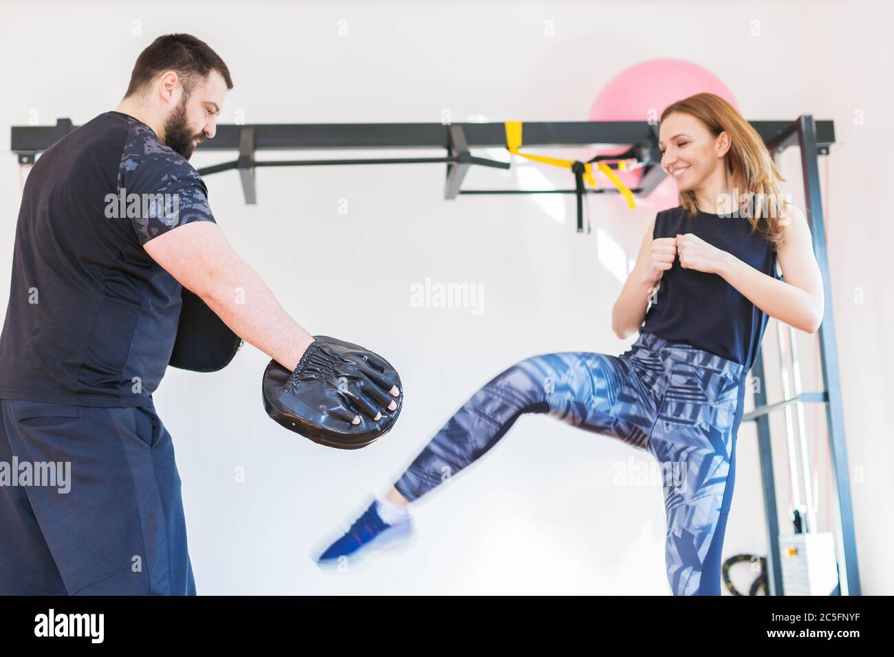 young woman boxing with personal trainer Stock Photo - Alamy