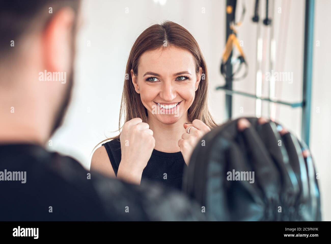 Male trainer training female boxer hi-res stock photography and images - Alamy