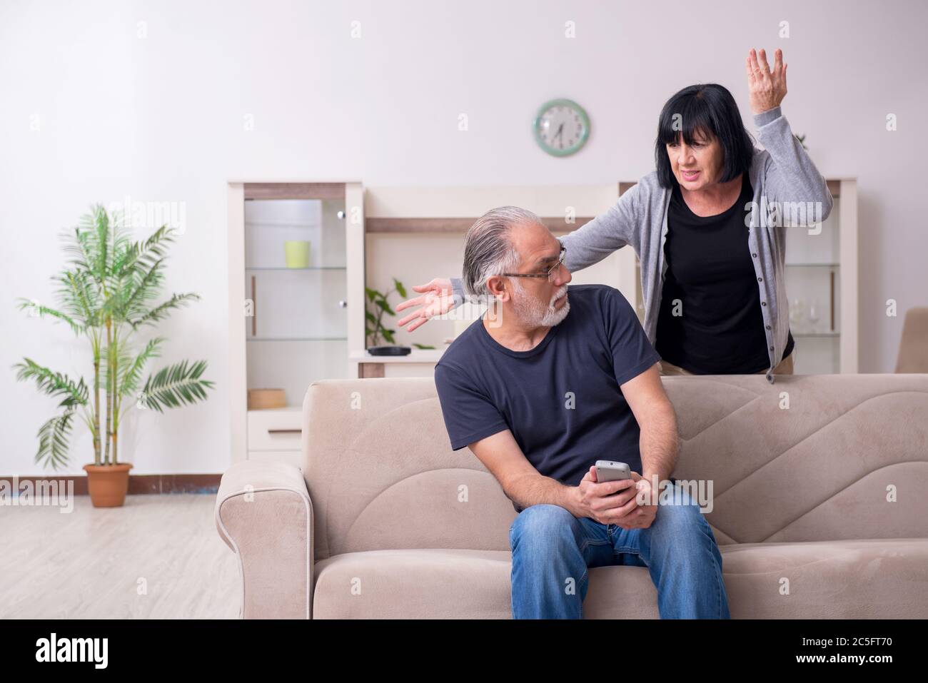 Old couple having argument at the home Stock Photo - Alamy