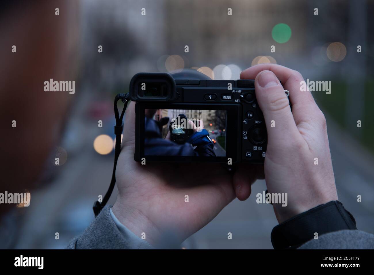 Taking pictures with camera through another camera and lens Stock Photo ...