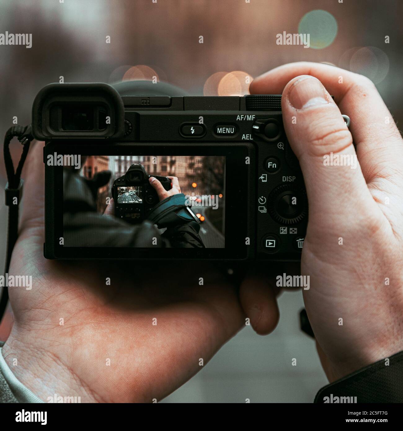 Taking pictures with camera through another camera and lens Stock Photo ...