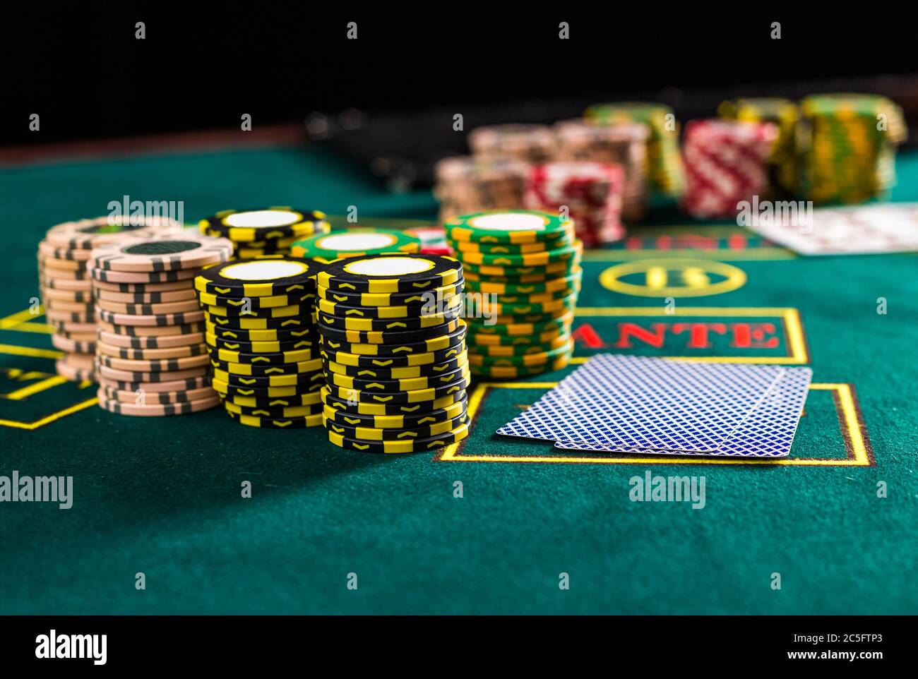 Poker chips on a poker table at the casino Stock Photo - Alamy