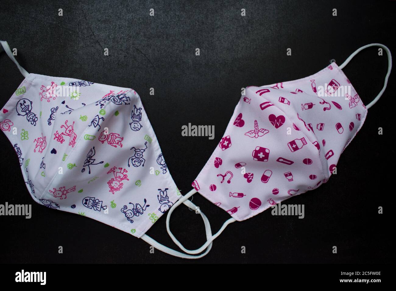 Kids pink medical face masks Stock Photo - Alamy