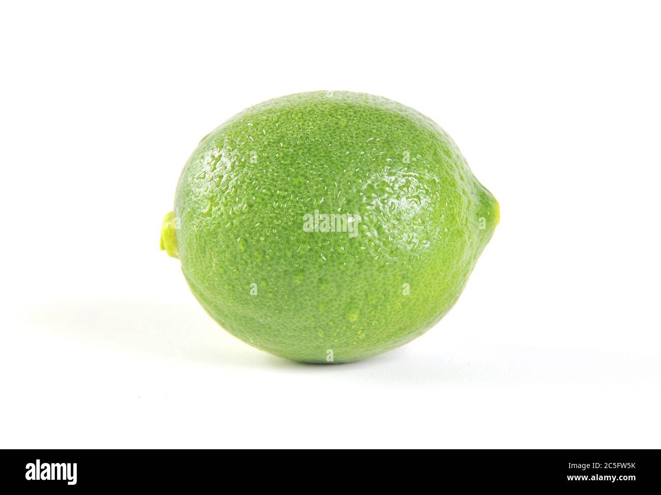 Whole lime isolated on white background. Single lime Stock Photo - Alamy