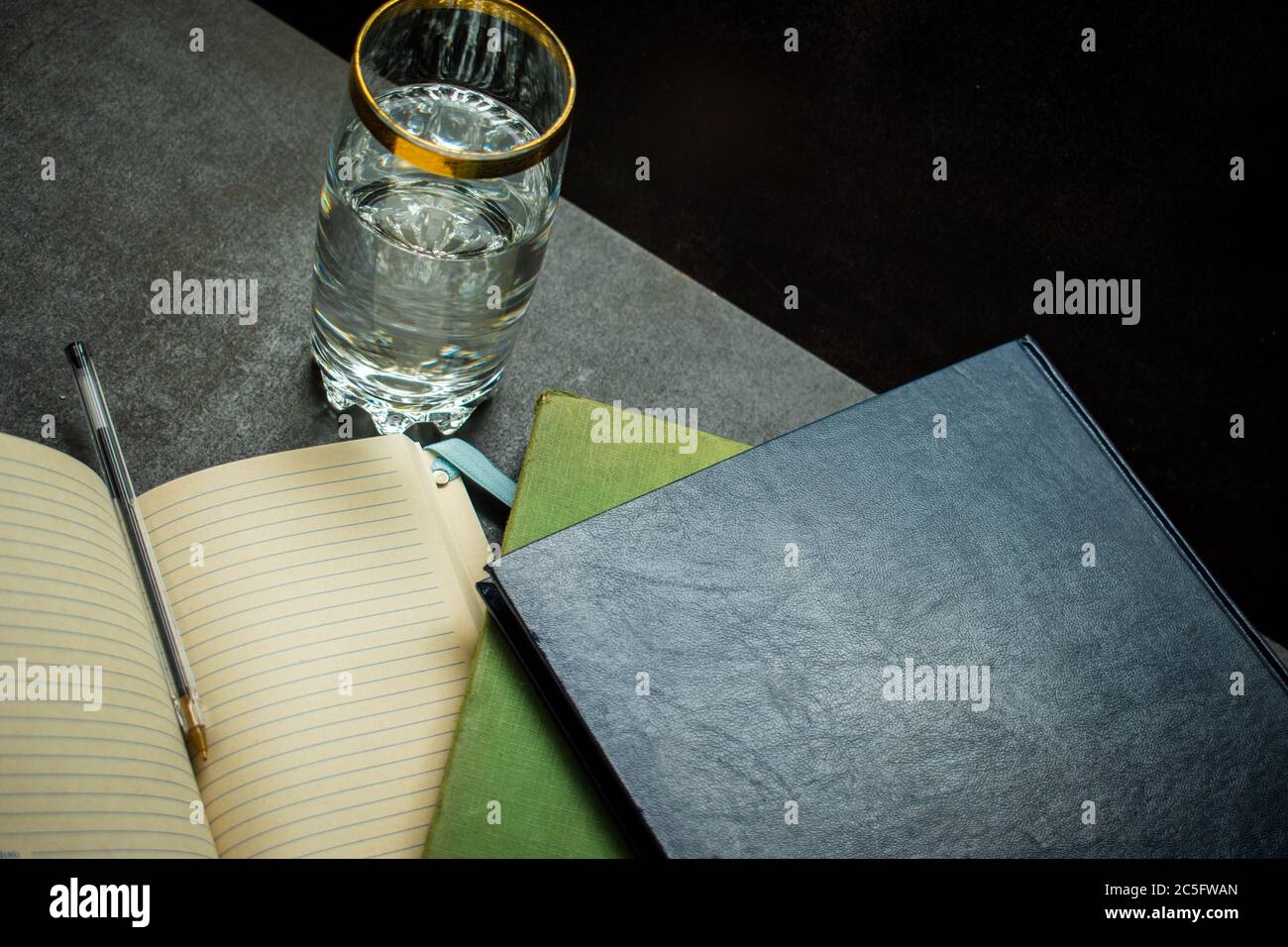 Books and pen on a desk hi-res stock photography and images - Alamy