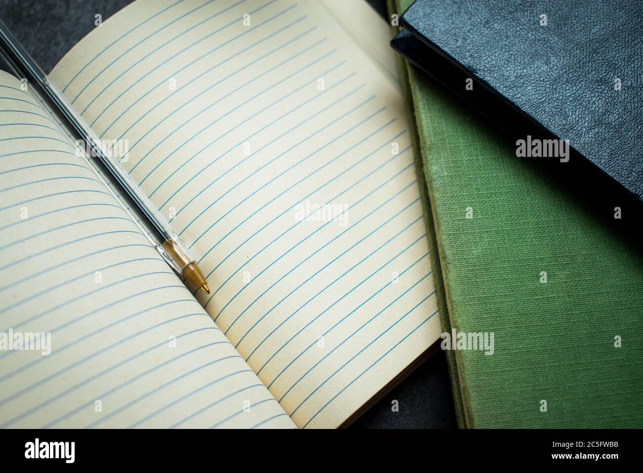 Books and pen on a desk hi-res stock photography and images - Alamy