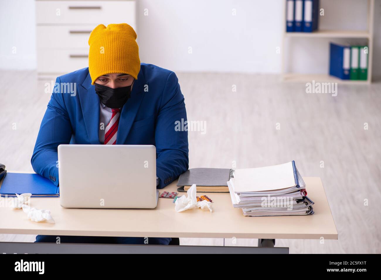 Sick employee suffering at workplace from covid-19 Stock Photo - Alamy
