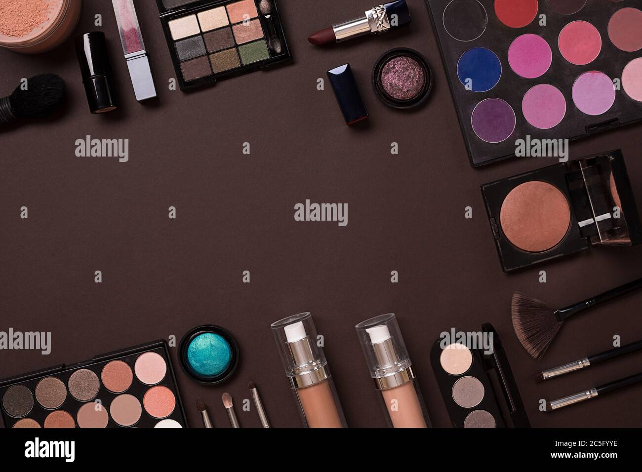 The women's cosmetics set on a brown background, modern woman Stock ...
