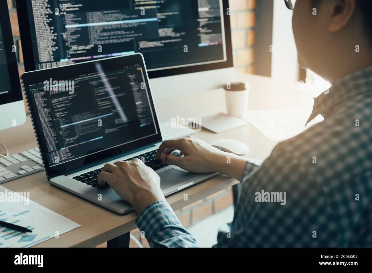 Asian Man Working Development Of Programming And Encryption Technology