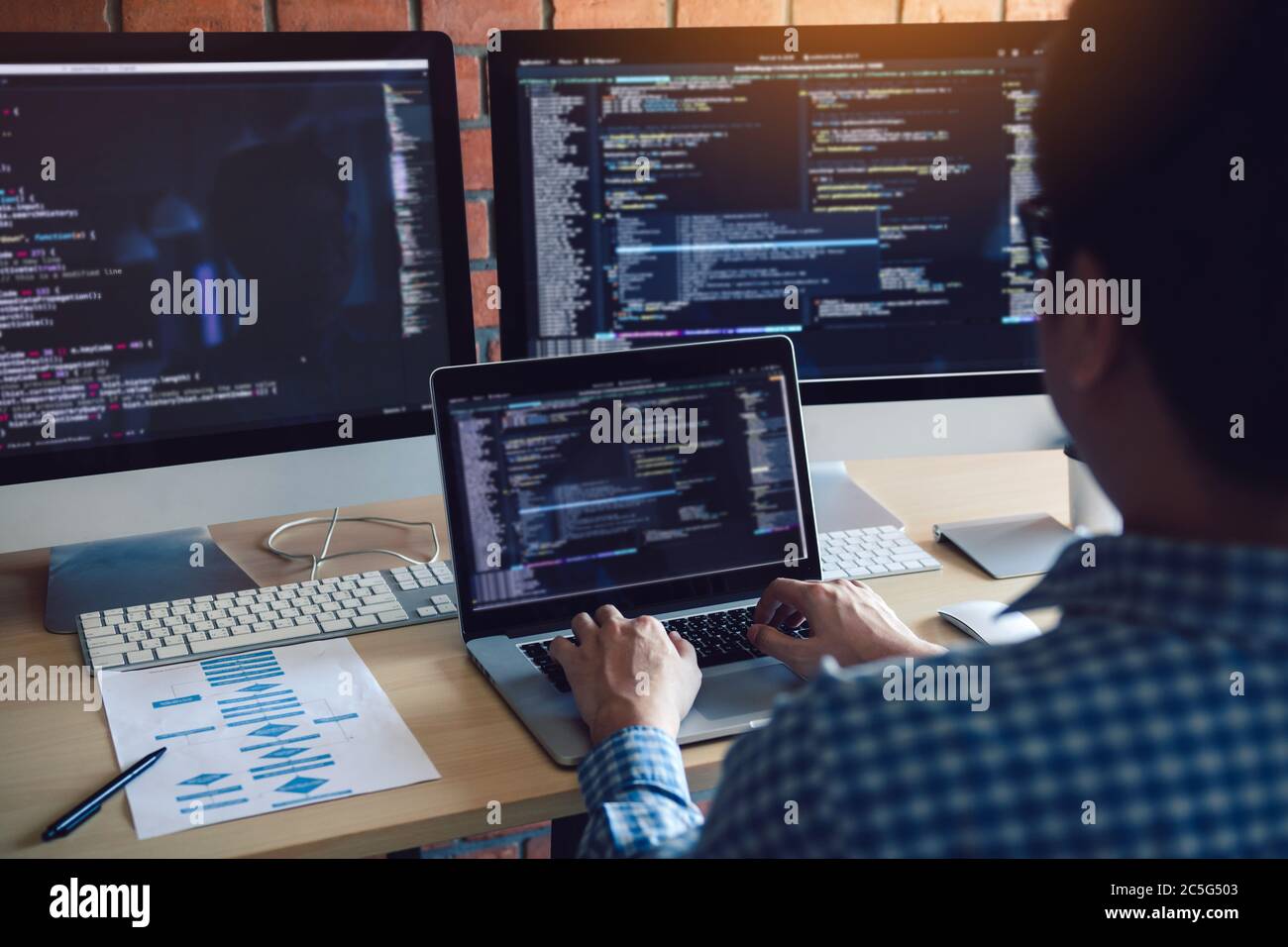 Serious web developer typing hi-res stock photography and images - Alamy
