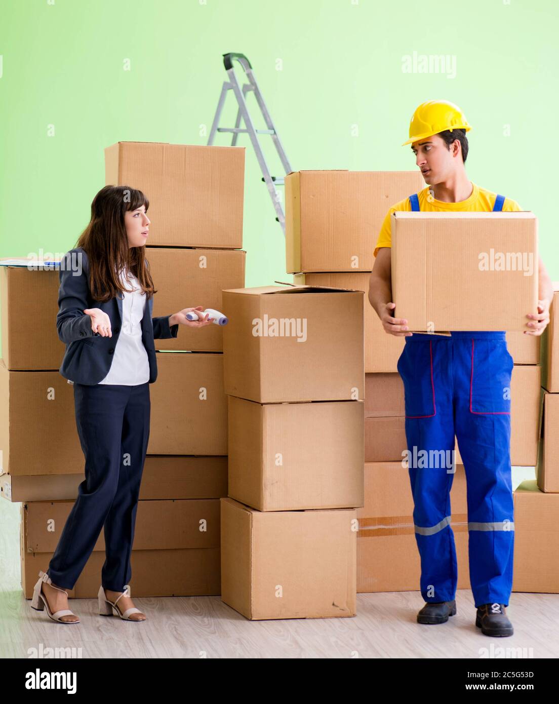 The woman boss and man contractor working with boxes delivery Stock ...