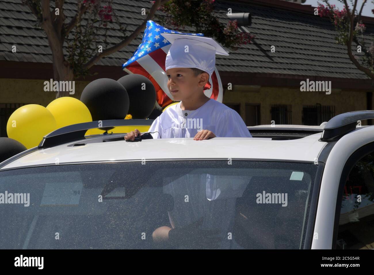 A procession of vehicles arrives at the Nueva Maravilla Child ...