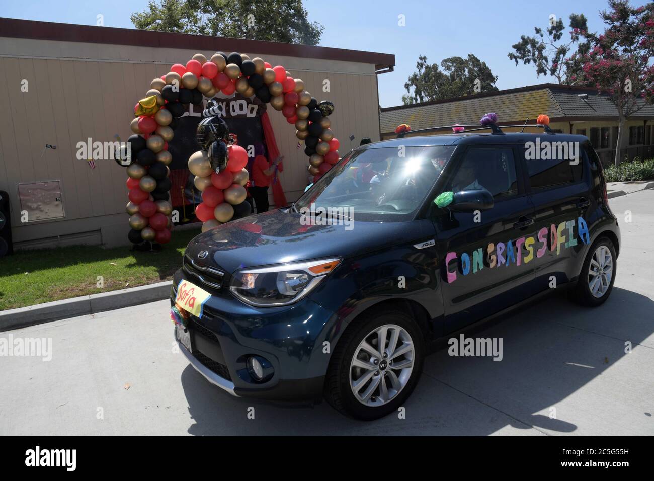 A procession of vehicles arrives at the Nueva Maravilla Child ...