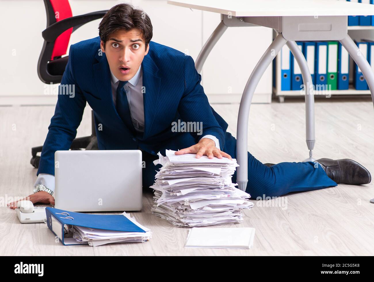 The tired exhausted businessman working overtime in office Stock Photo ...