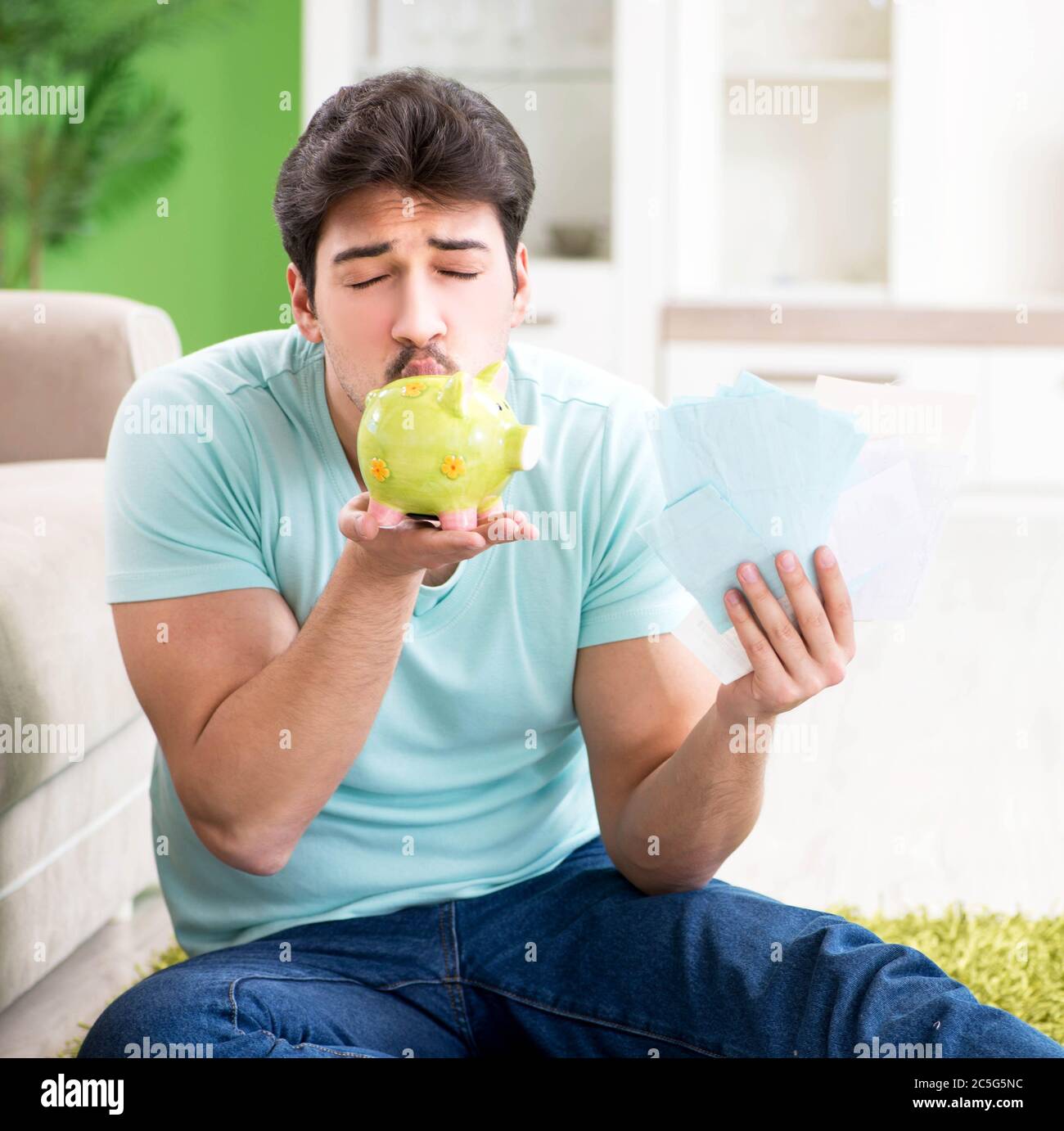The young man struggling with personal finance and bills Stock Photo ...