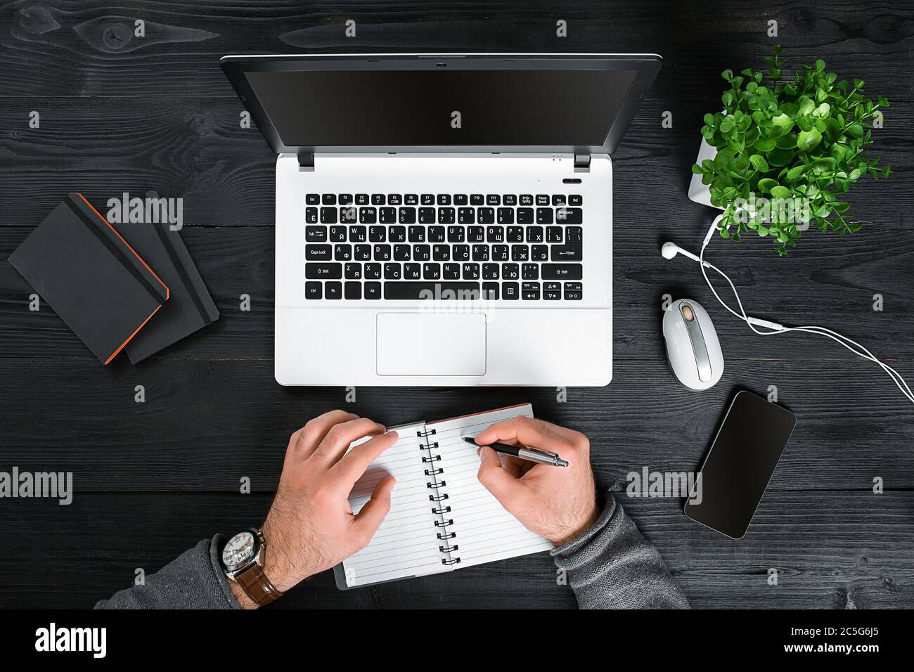 Directly above view of human hands typing on laptop Stock Photo - Alamy