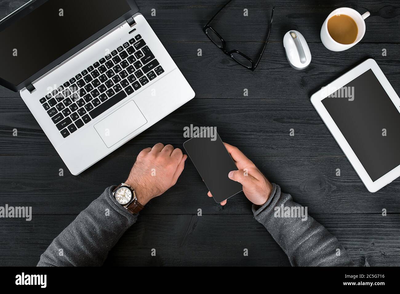 Directly above view of human hands typing on laptop Stock Photo - Alamy