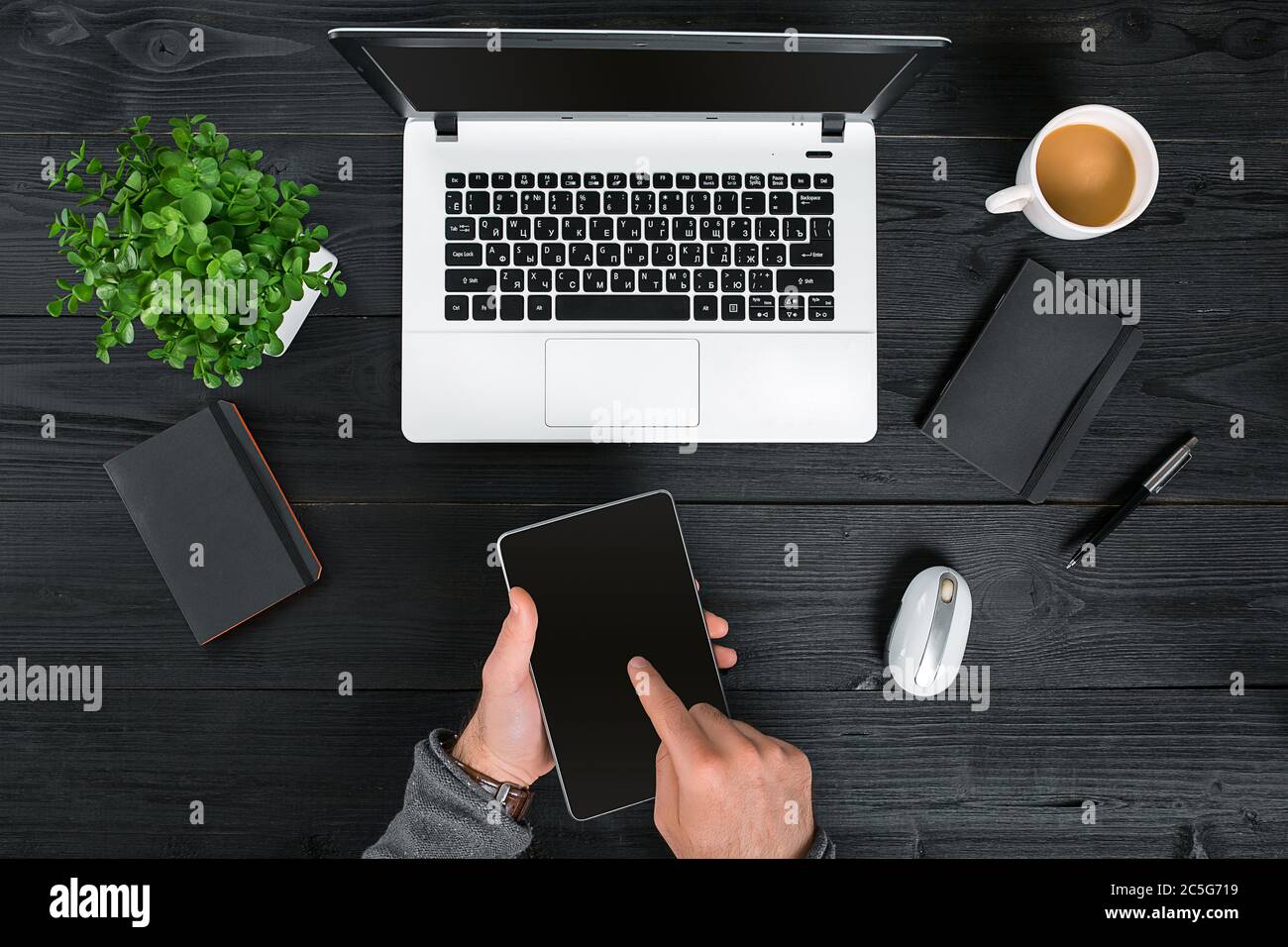 Directly above view of human hands typing on laptop Stock Photo - Alamy