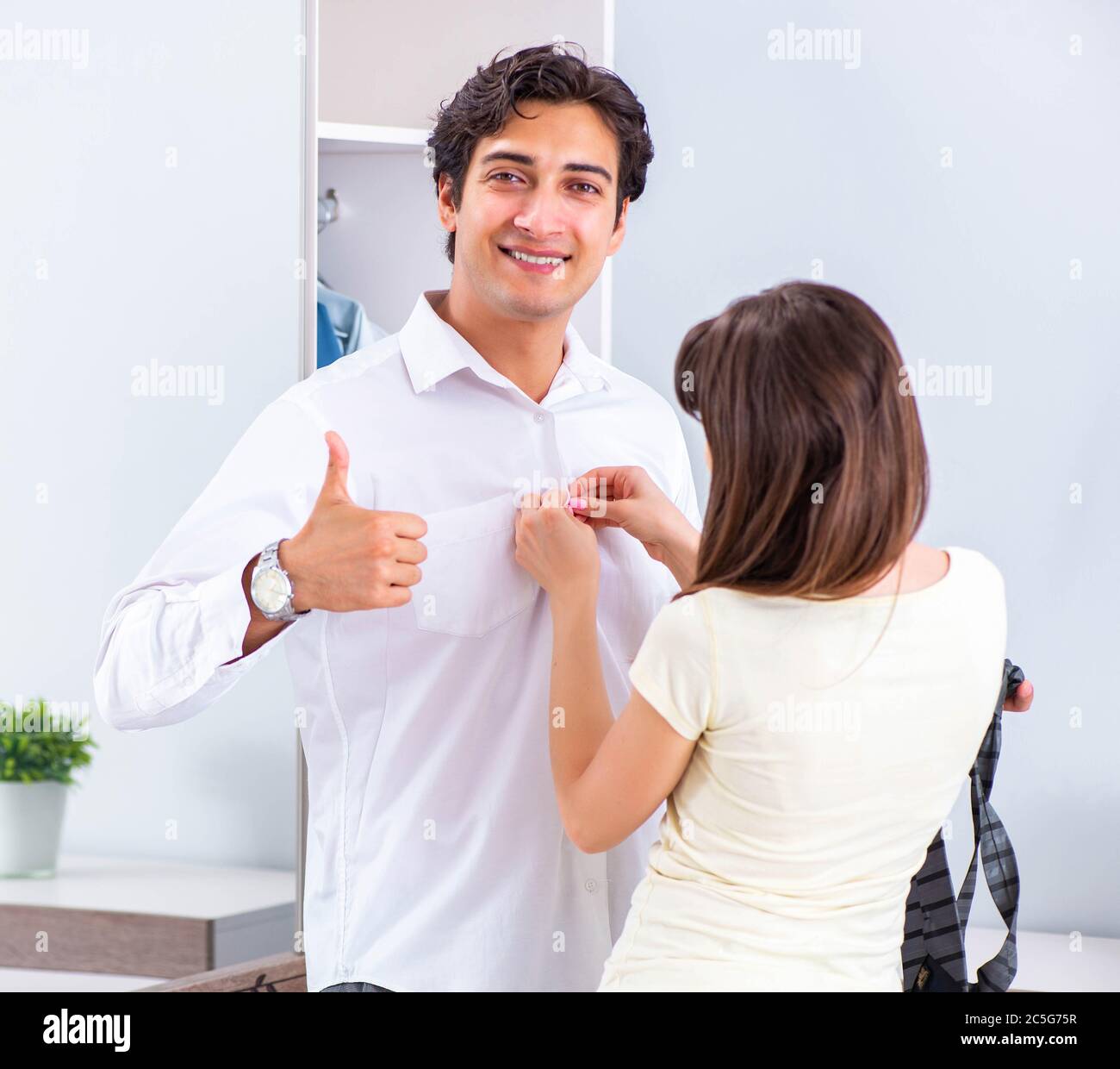 The woman sees her husband off to work Stock Photo - Alamy