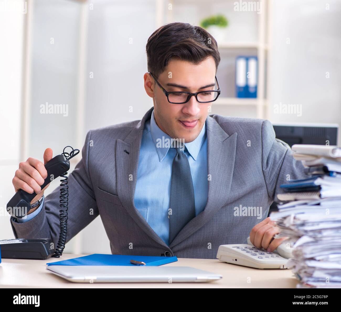 The desperate sad employee tired at his desk in call center Stock Photo ...