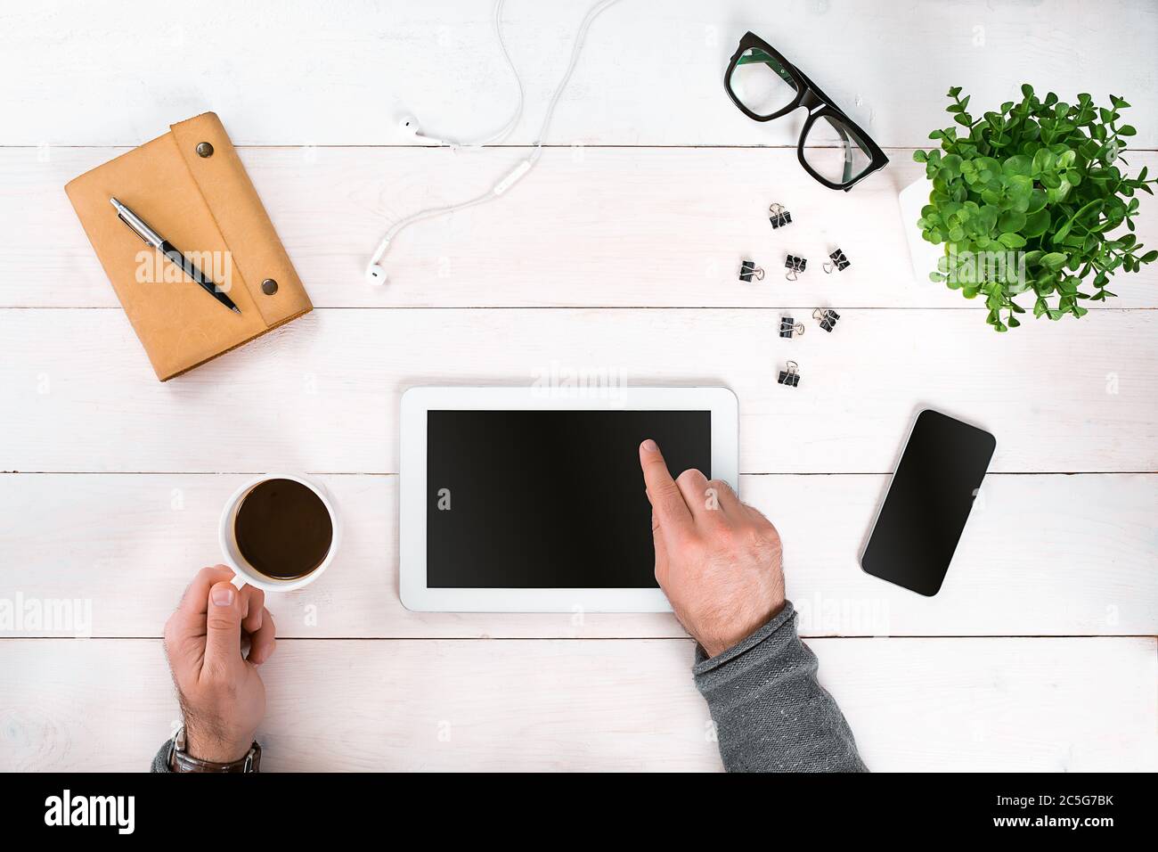 Directly above view of human hands with digital tablet Stock Photo - Alamy