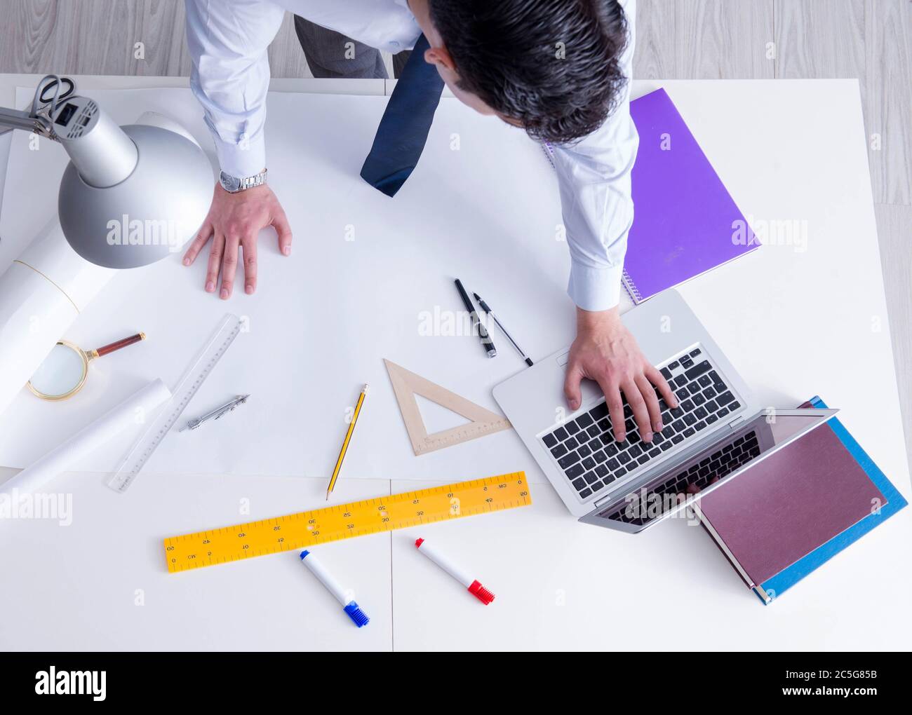 The engineer working on new project drawings Stock Photo - Alamy