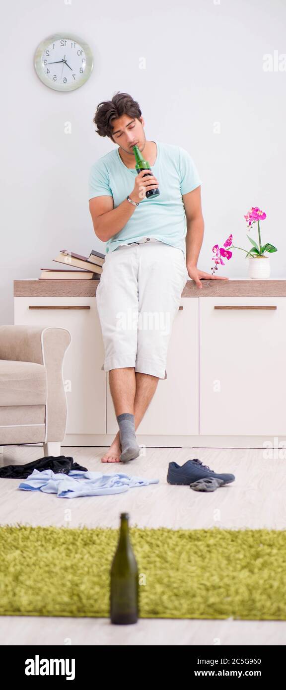 The young drunk handsome man after party at home Stock Photo - Alamy