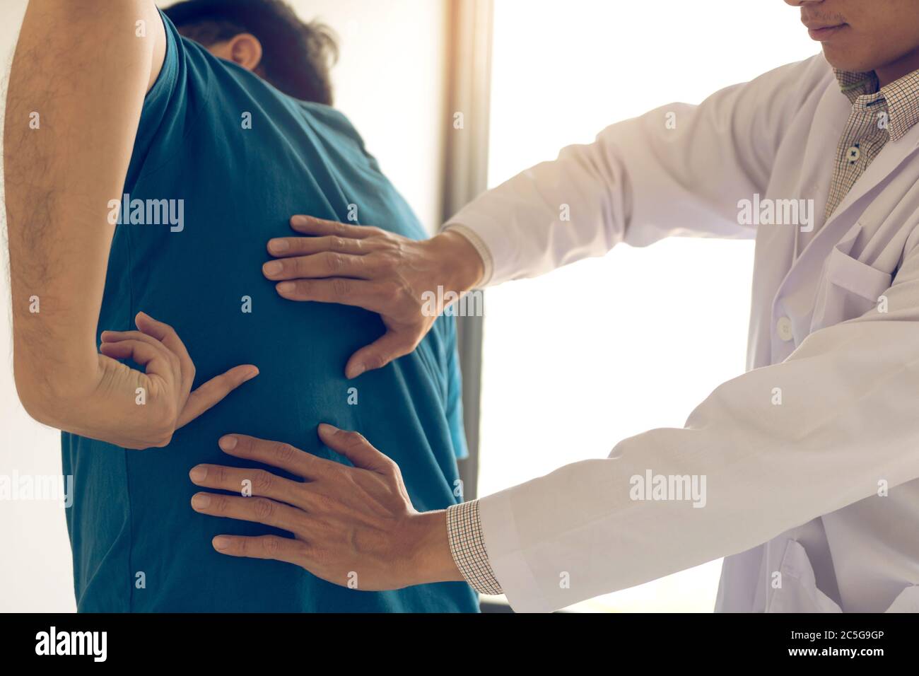 Patient is pointing to the point where the muscle pain is provided to ...