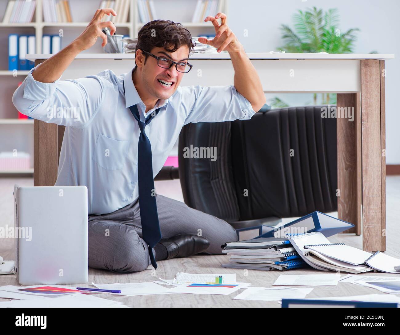 The bankrupt businessman angry in the office floor Stock Photo - Alamy