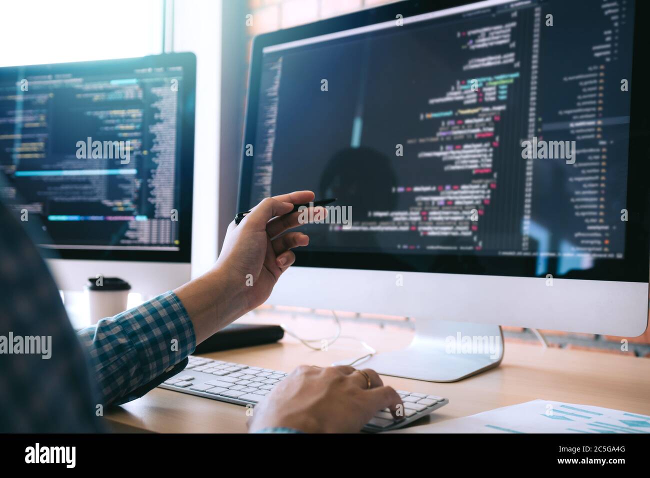 Programmer man pointing pen html hi-res stock photography and images - Alamy