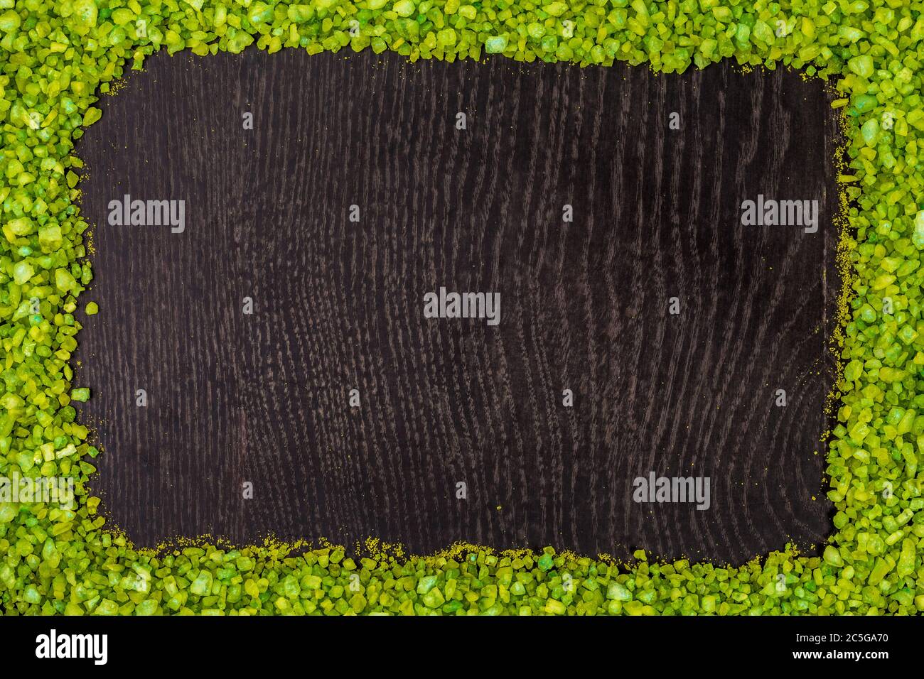 Sea salt grains frame on the black background Stock Photo - Alamy