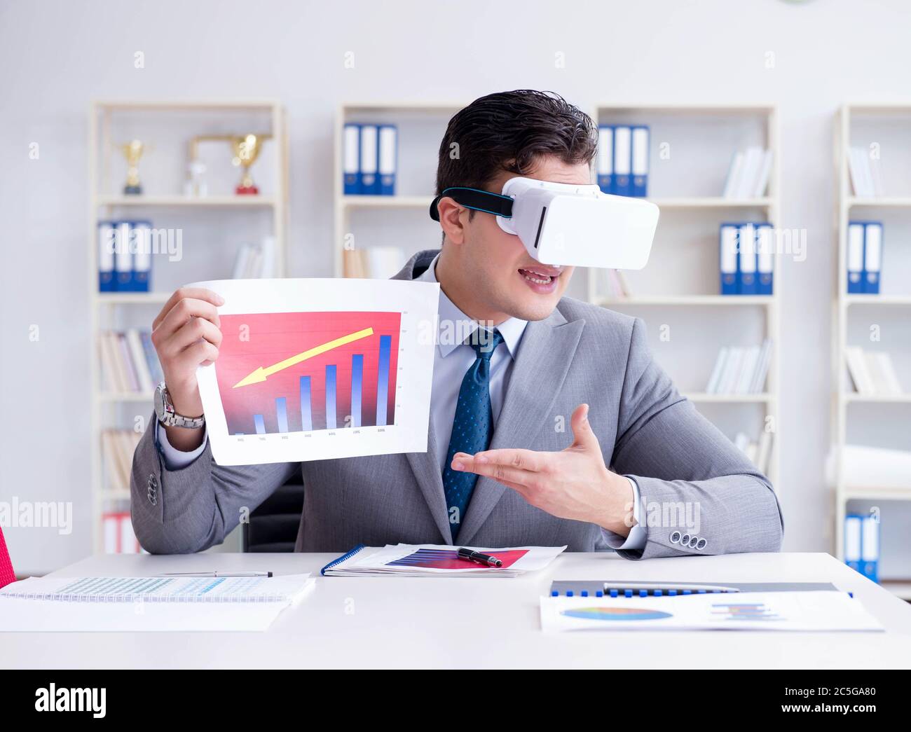 The businessman with virtual reality glasses in the office Stock Photo ...